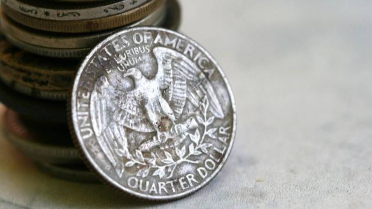 A quarter, a butterfly and a Ford pick up