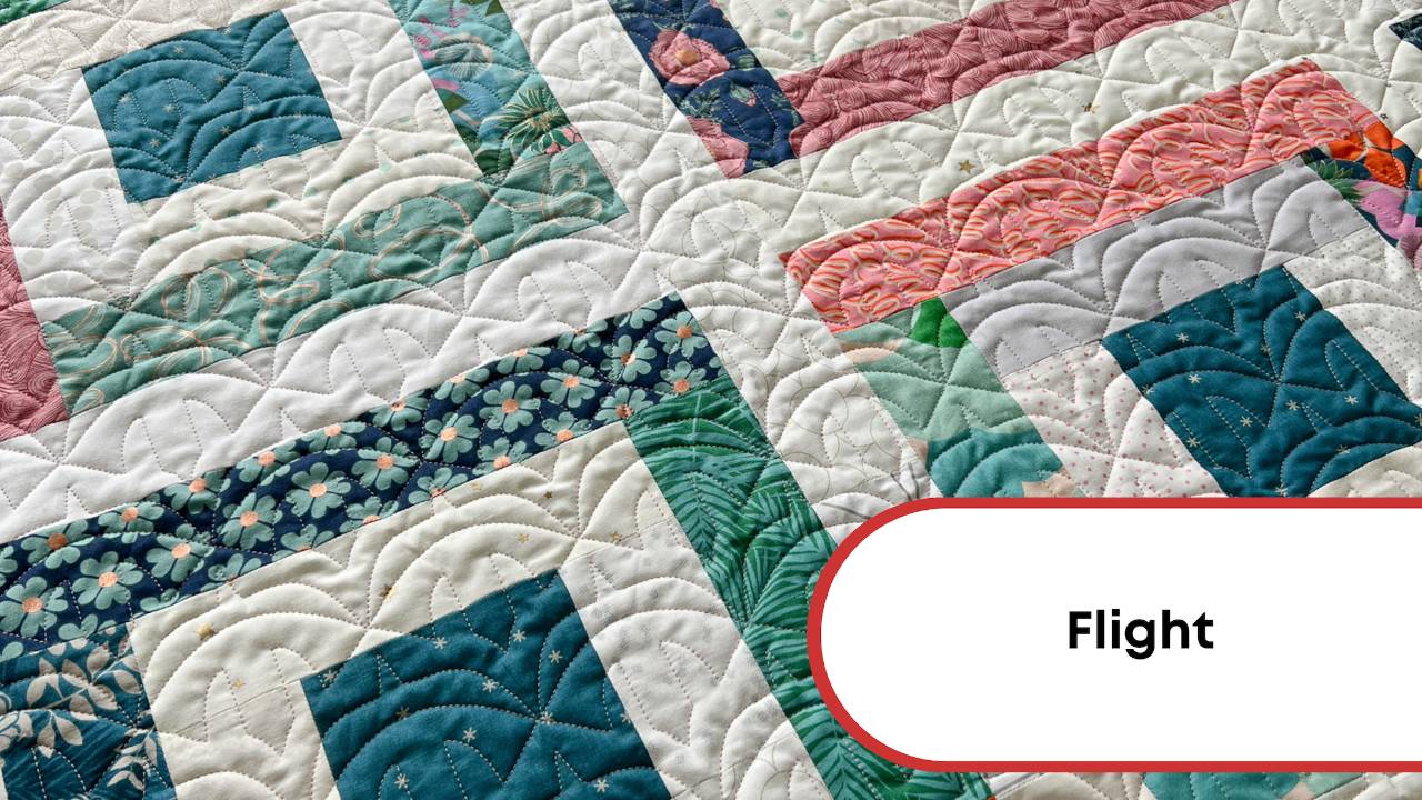 Flight Edge-to-Edge Design on a Scrappy, Modern Log Cabin Quilt