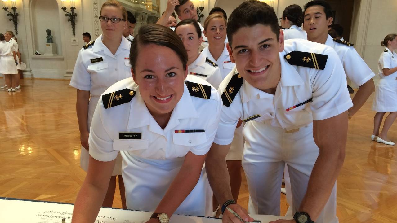 Signing the 2 for 7 at the United States Naval Academy